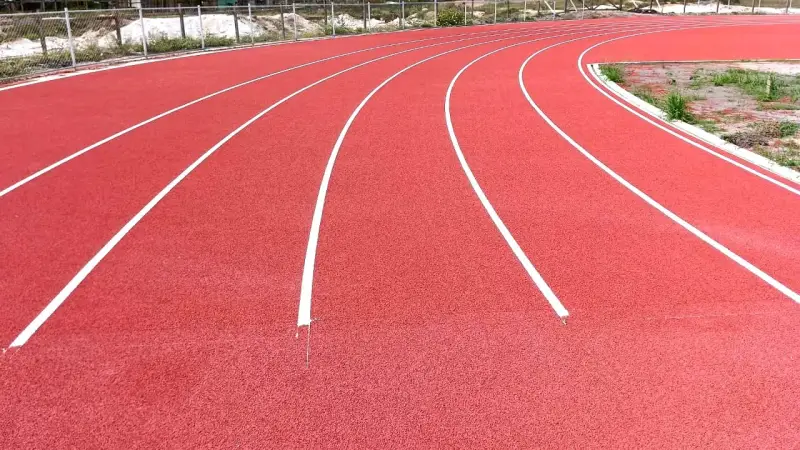 Final stage of Linden synthetic track moving apace, running lanes marked